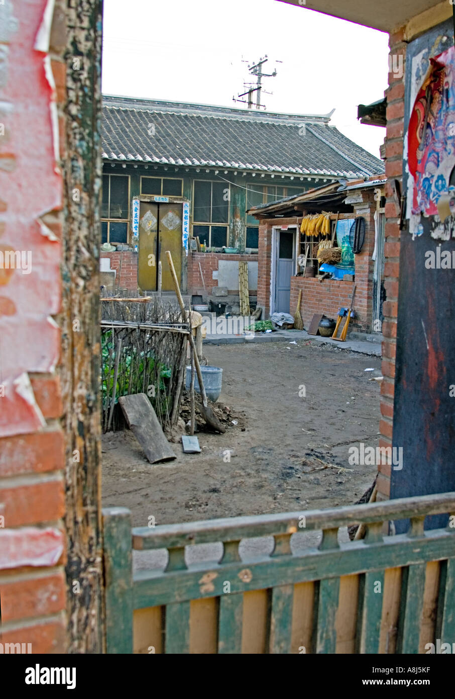 CHINA SIMATAI Brick communal farmhouses with clothes on the line and ...