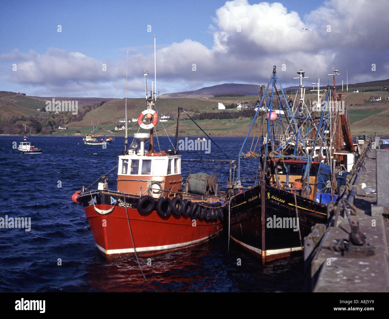 Spring time view part of Uig village on Isle Of Skye fishing boats in ...