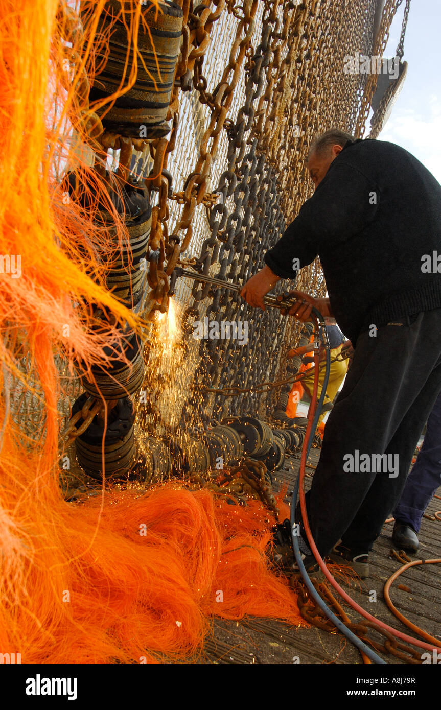 Fisher men at work with cuting torch oxyacetylence burner in the ...