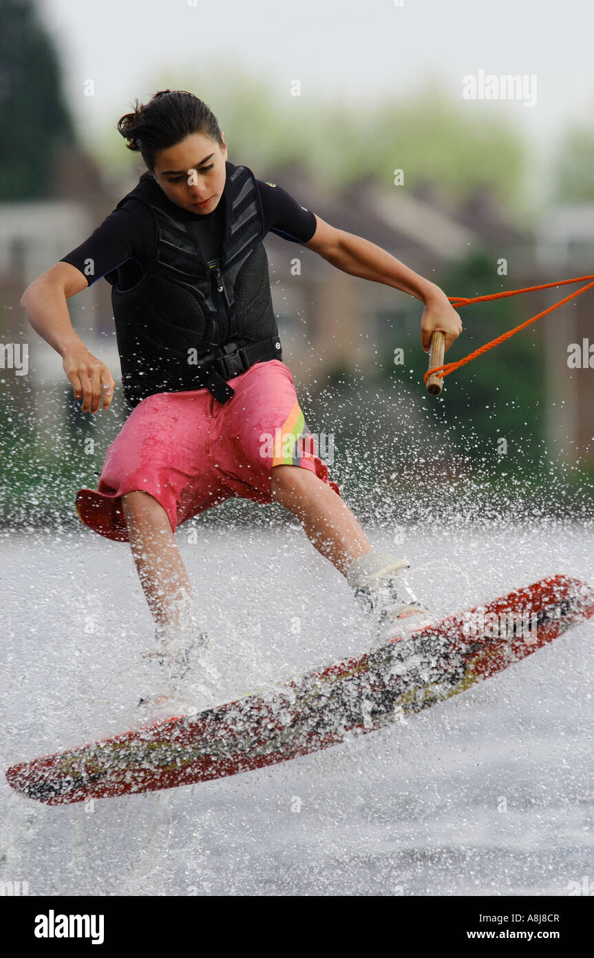 Wakeboarding girl close shot on the flat water 2006 with background ...
