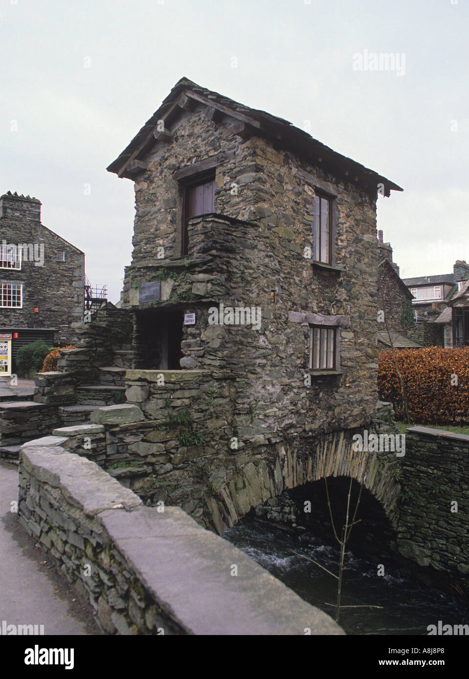 Bridge House tiny stone house on top of a bridge over a stream in the ...
