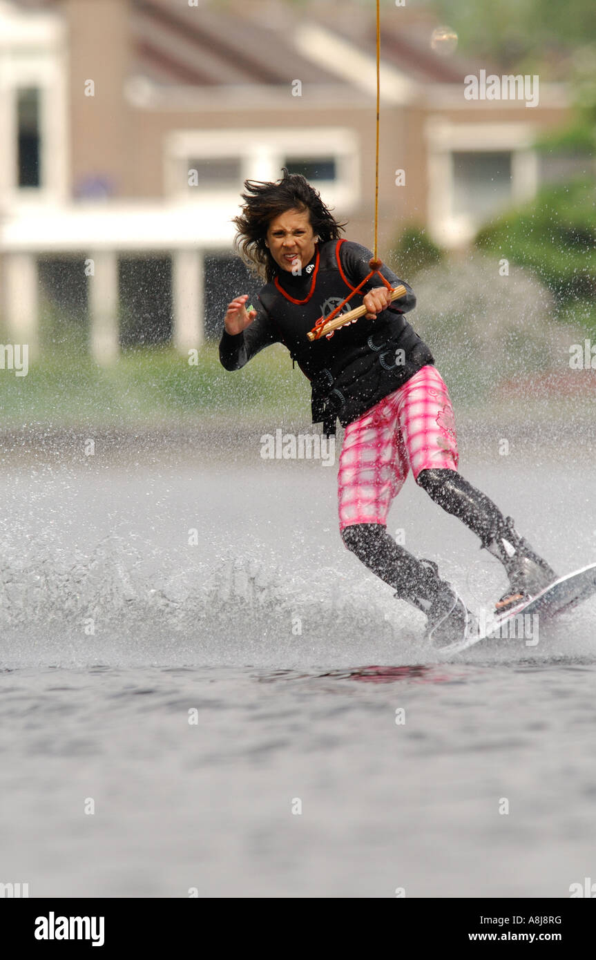 Wakeboarding girl close shot on the flat water 2006 with background ...