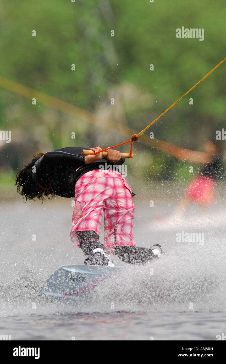 Wakeboarding girl close shot on the flat water 2006 with background ...