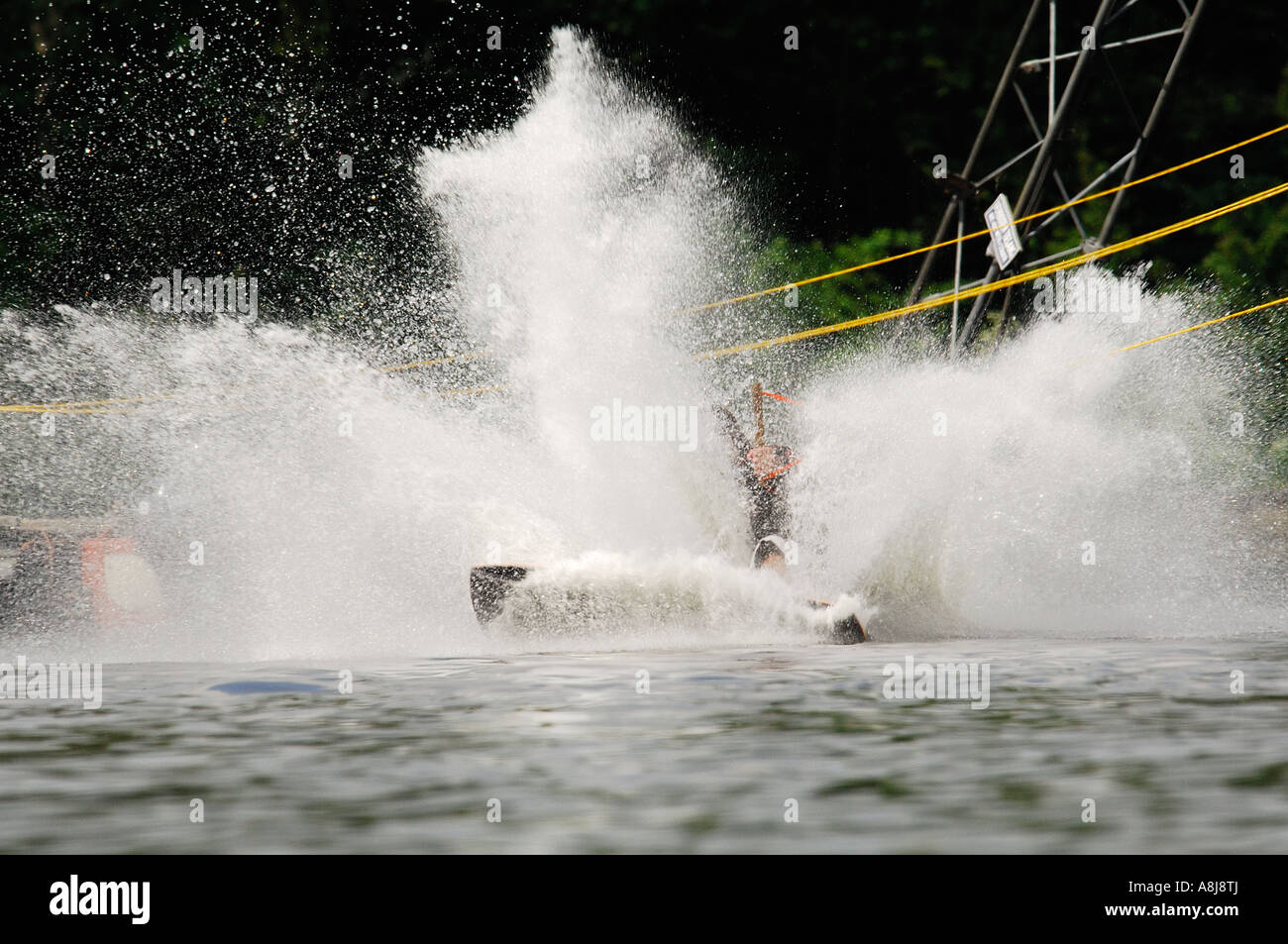 Wakeboarding boy close shot on the flat water 2006 with background wit ...