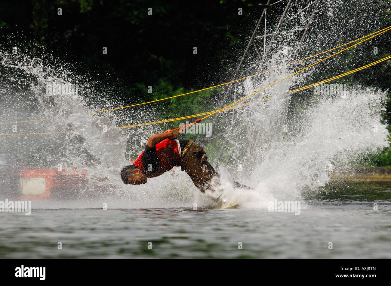 Wakeboarding boy close shot on the flat water 2006 with background wit ...