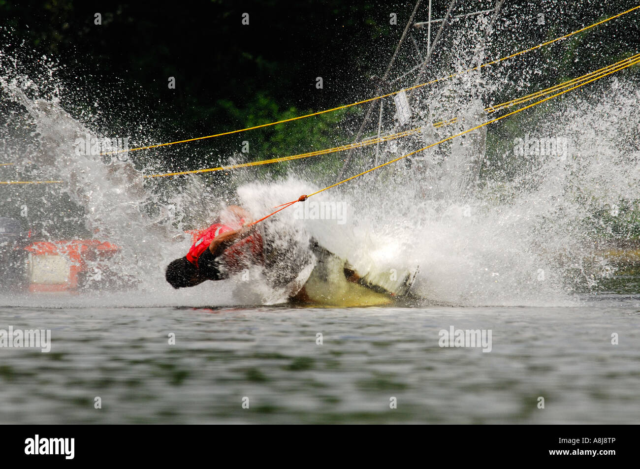 Wakeboarding boy close shot on the flat water 2006 with background wit ...