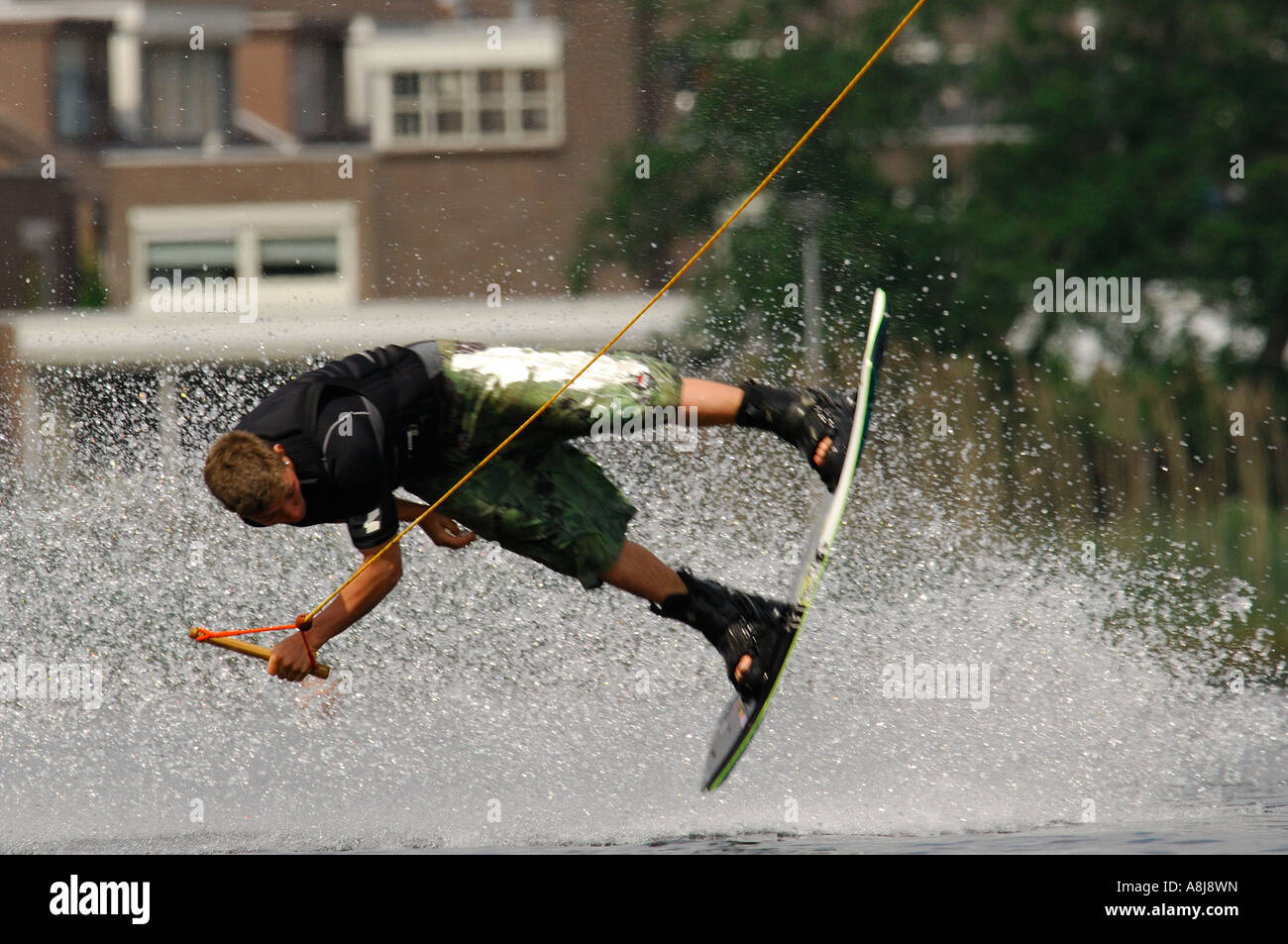 Wakeboarding jumping boy close shot on the flat water 2006 Stock Photo ...