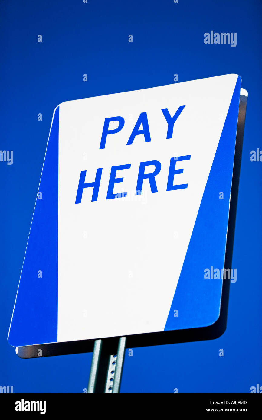 PAY HERE SIGN Stock Photo - Alamy
