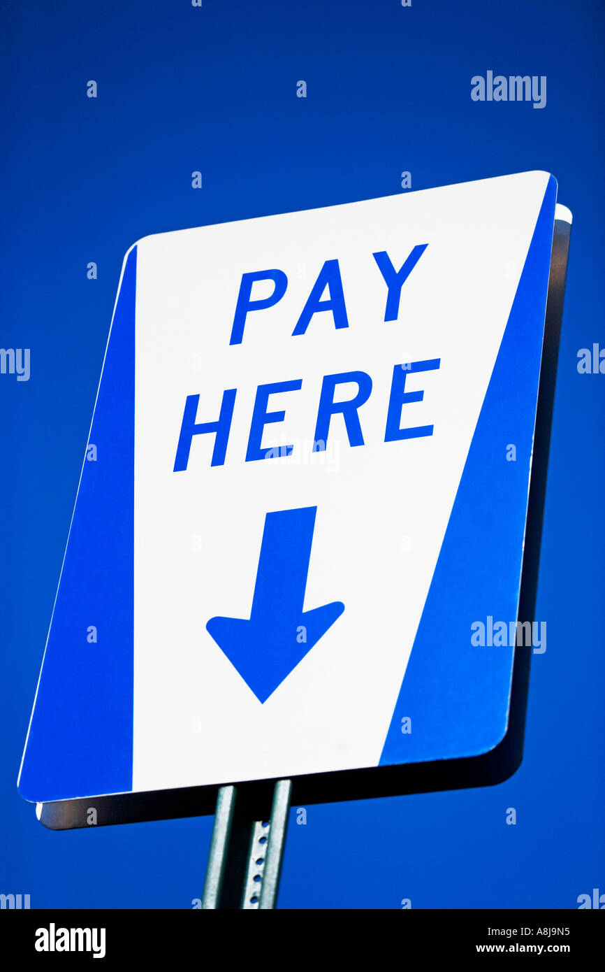 PAY HERE SIGN Stock Photo - Alamy