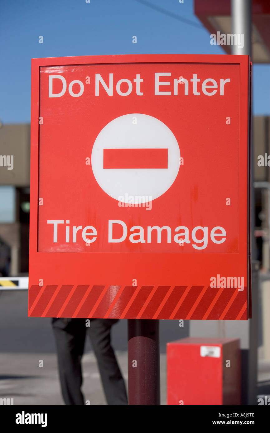 DO NOT ENTER, TIRE DAMAGE SIGN Stock Photo - Alamy
