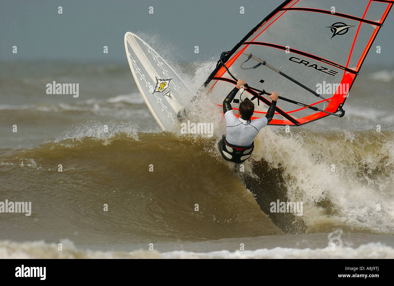 Men try go out from the beach Noordwijk beach with big wave Stock Photo ...