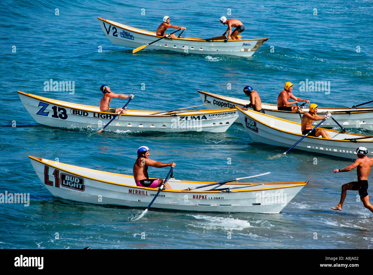 lifeguard dory racing boats Stock Photo - Alamy