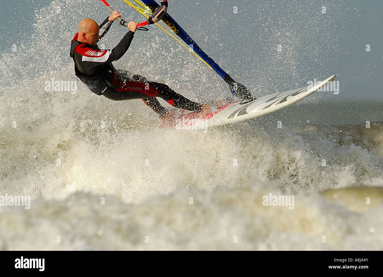 Windsurfing mid adult men on the water Sea on big wave Place Domburg ...
