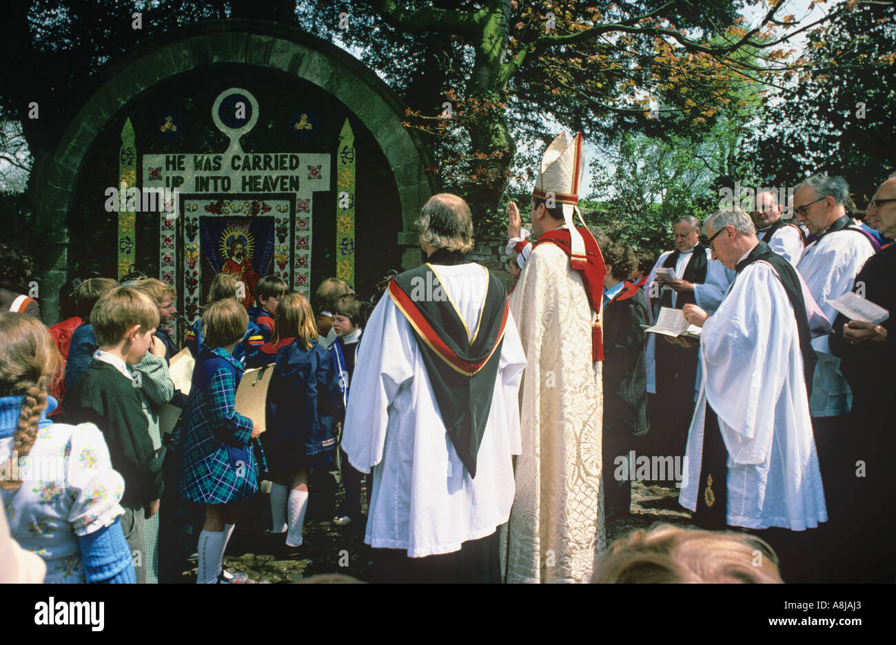 Bishop and priests blessing Hall Well at Tissington Derbyshire party of ...