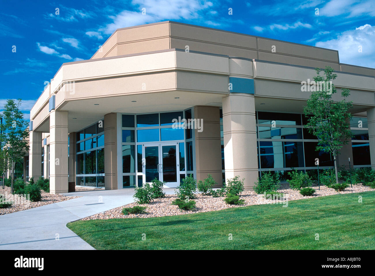 Front entrance of new office building with landscaping Stock Photo - Alamy