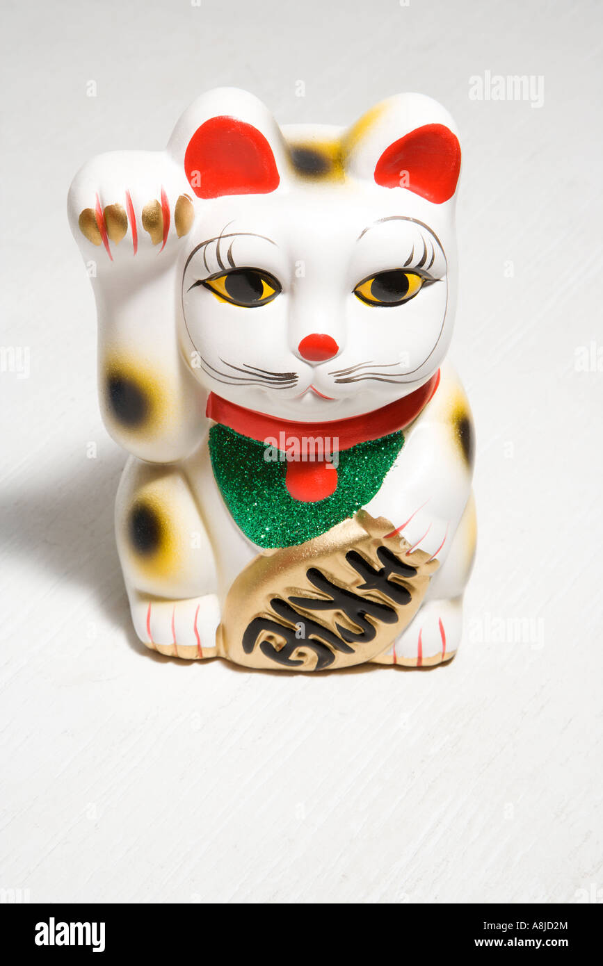 Japanese lucky cat figurine Stock Photo - Alamy