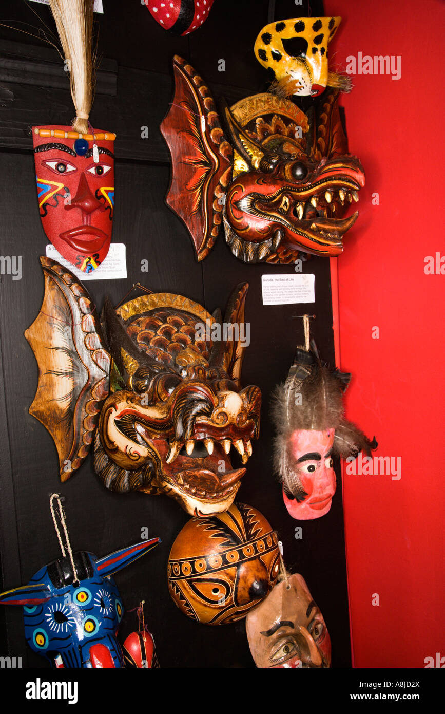 Folk art masks hanging in retail store Stock Photo - Alamy