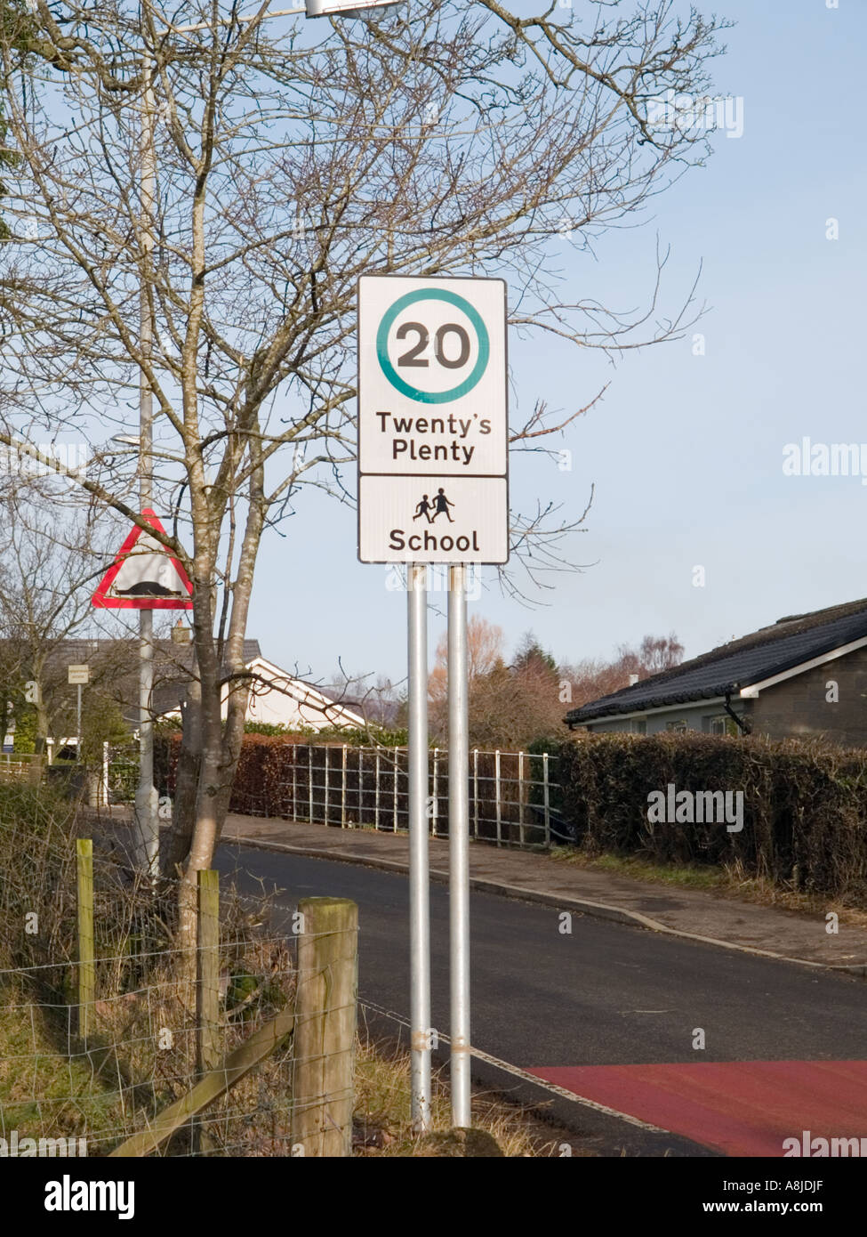 Twenty miles per hour speed limit sign and traffic calming scheme with ...