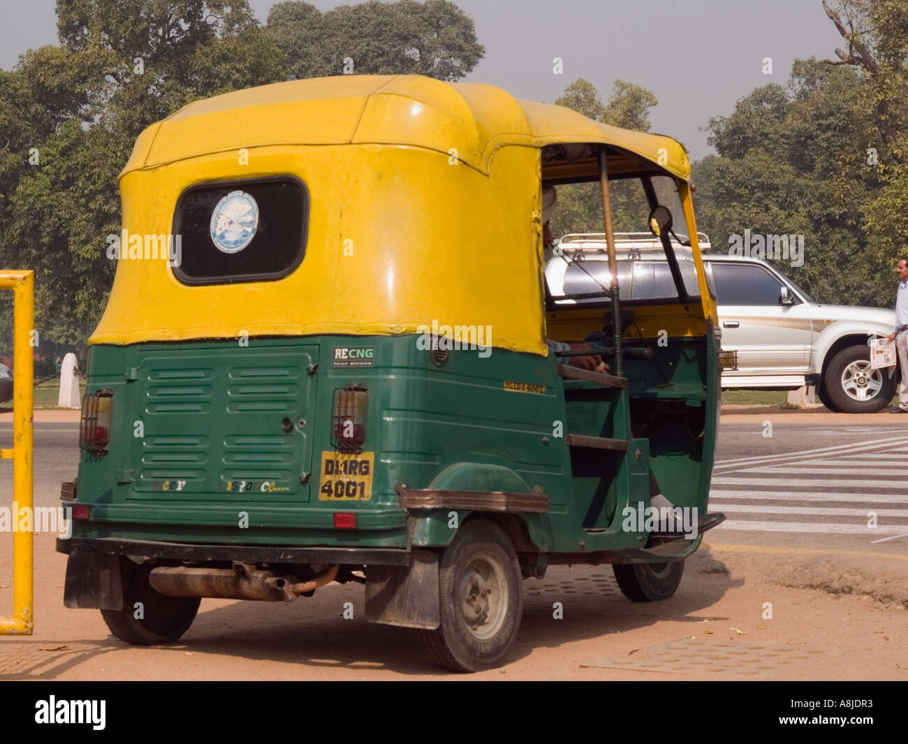 Green and Yellow auto rickshaw fueled by Compressed Natural Gas CNG to ...