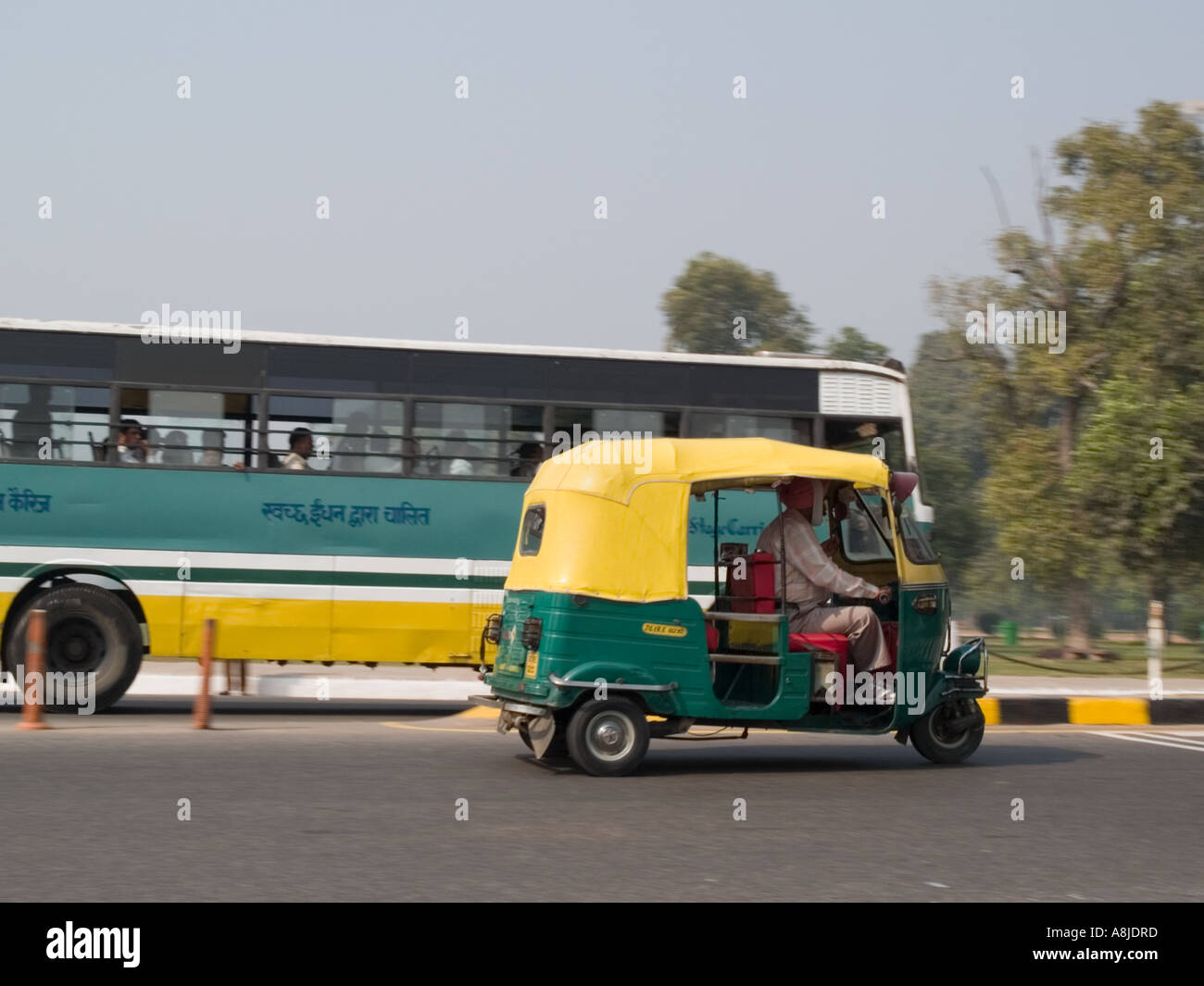 Green and Yellow auto rickshaw fueled by Compressed Natural Gas CNG in ...
