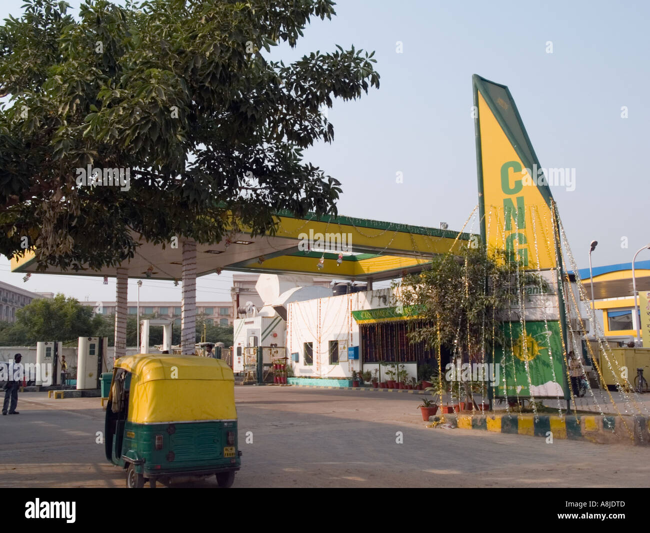 Gas station selling Compressed Natural Gas CNG used by green and yellow ...