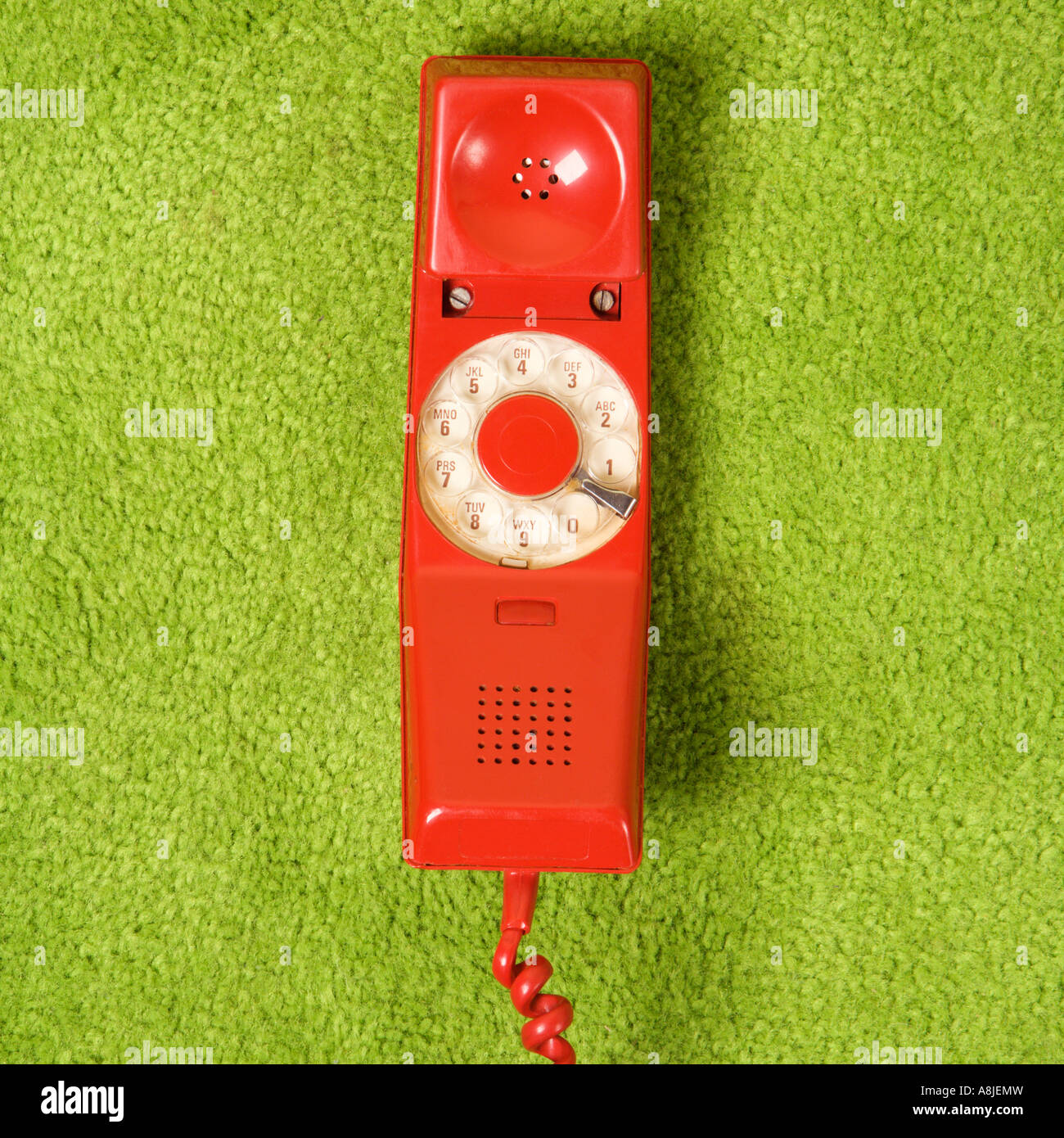 Red vintage rotary telephone receiver lying on 70 s green carpet Stock ...