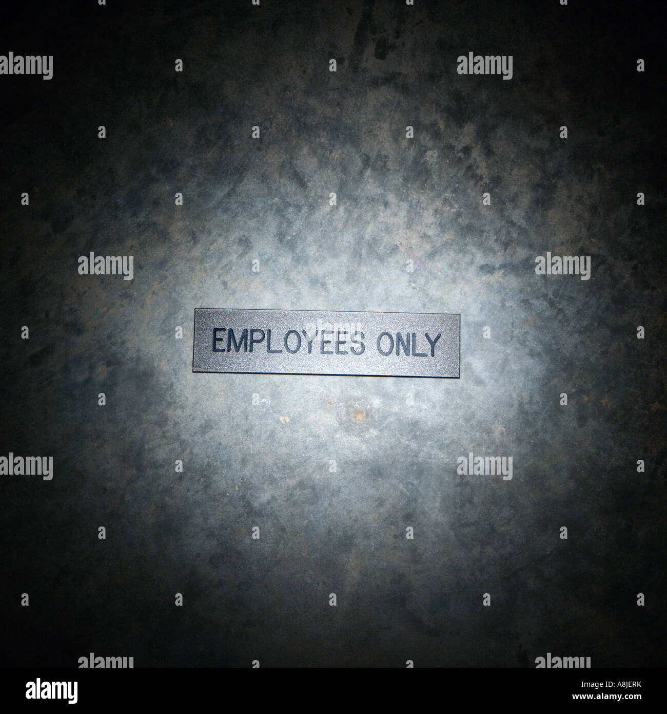 Metal employees only sign on textured background Stock Photo - Alamy