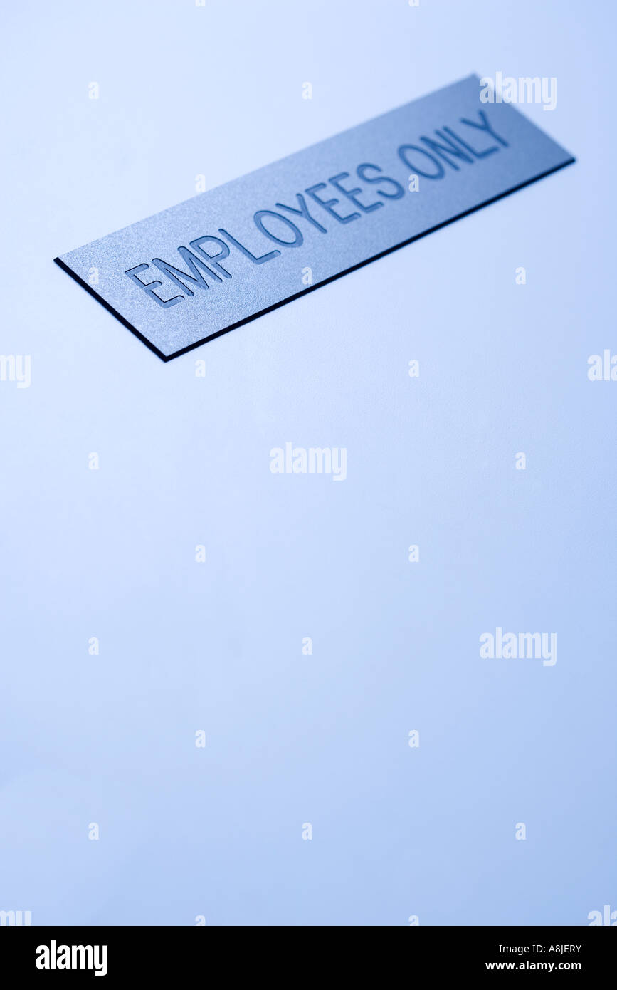 Blue employees only sign Stock Photo - Alamy