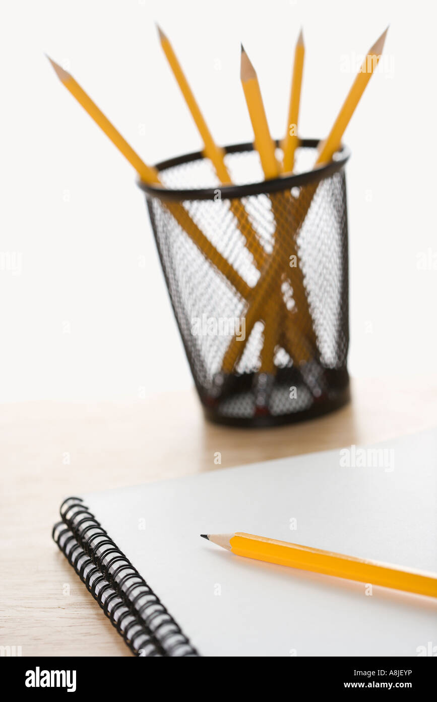 Pencils and spiral bound notebooks arranged on a desk Stock Photo - Alamy