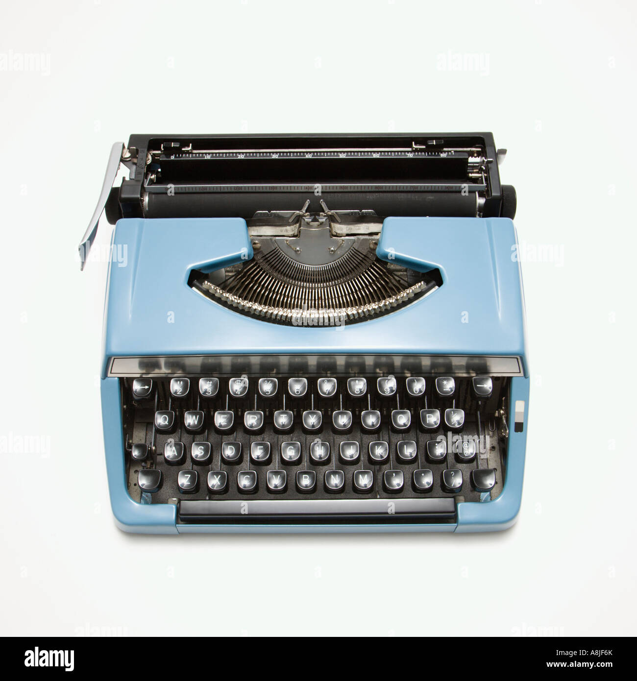 Blue vintage typewriter on white background Stock Photo - Alamy