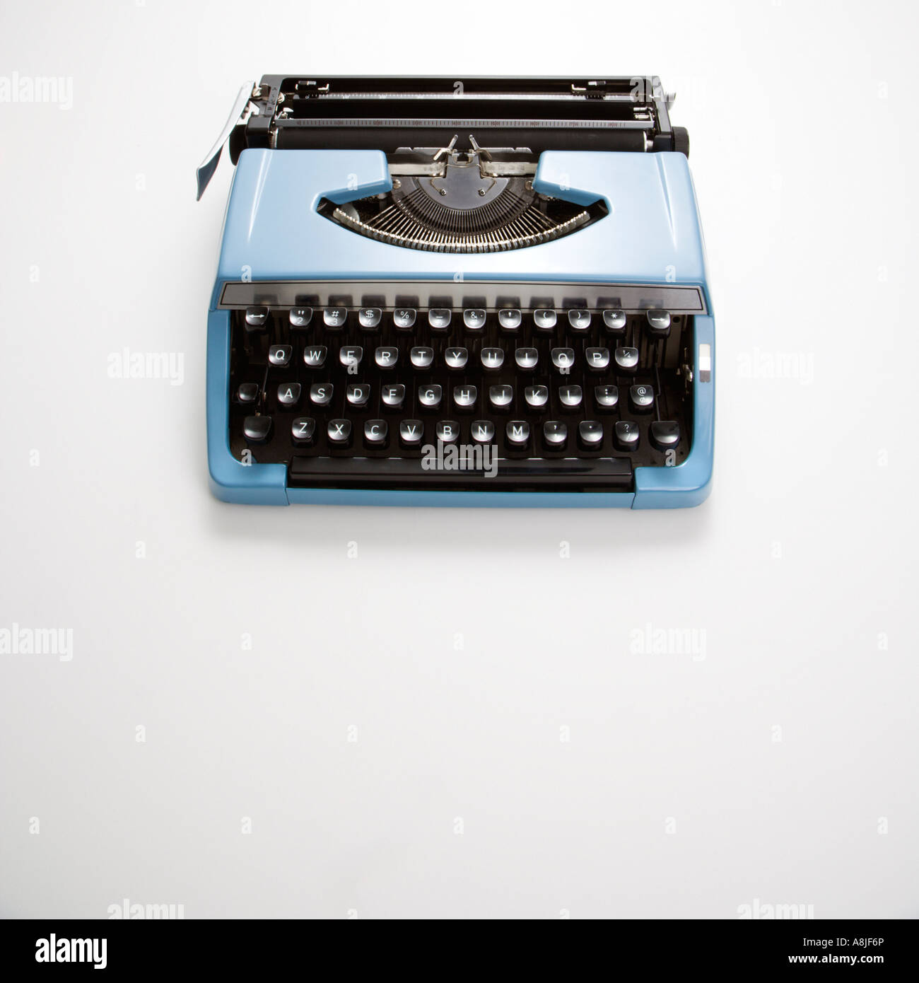 Blue vintage typewriter on white background Stock Photo - Alamy