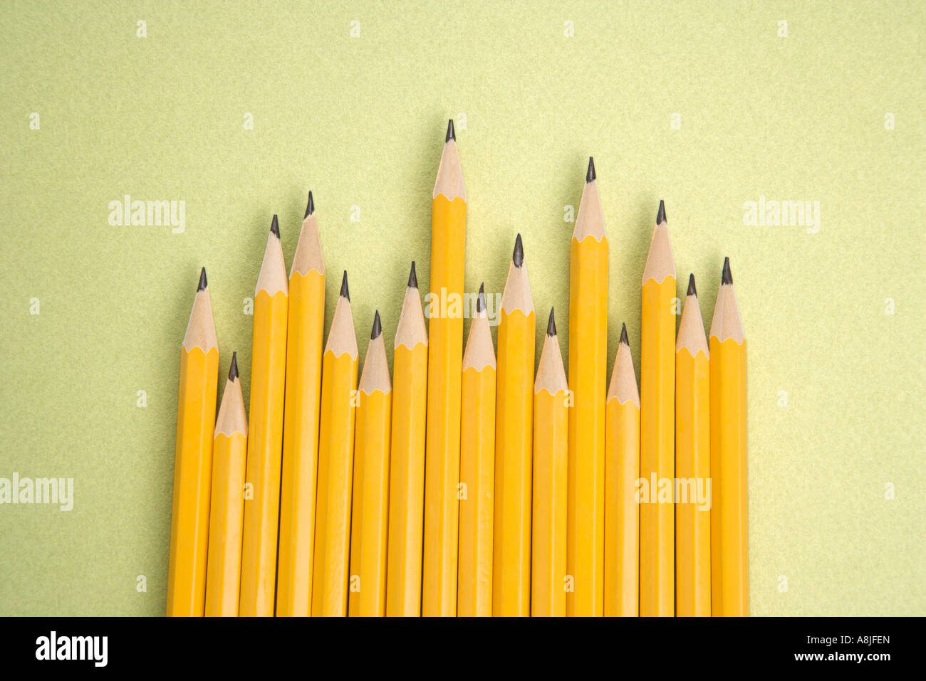 Sharp pencils arranged in an uneven row Stock Photo - Alamy