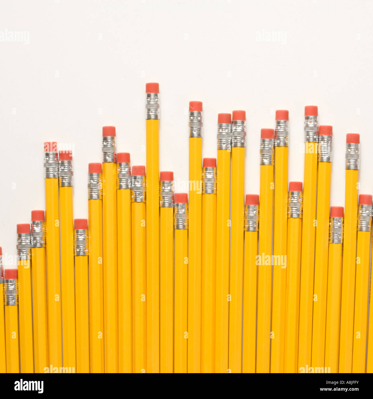 Uneven row of eraser ends of pencils Stock Photo - Alamy