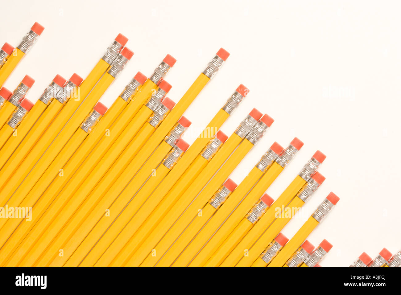 Uneven diagonal row of eraser ends of pencils Stock Photo - Alamy