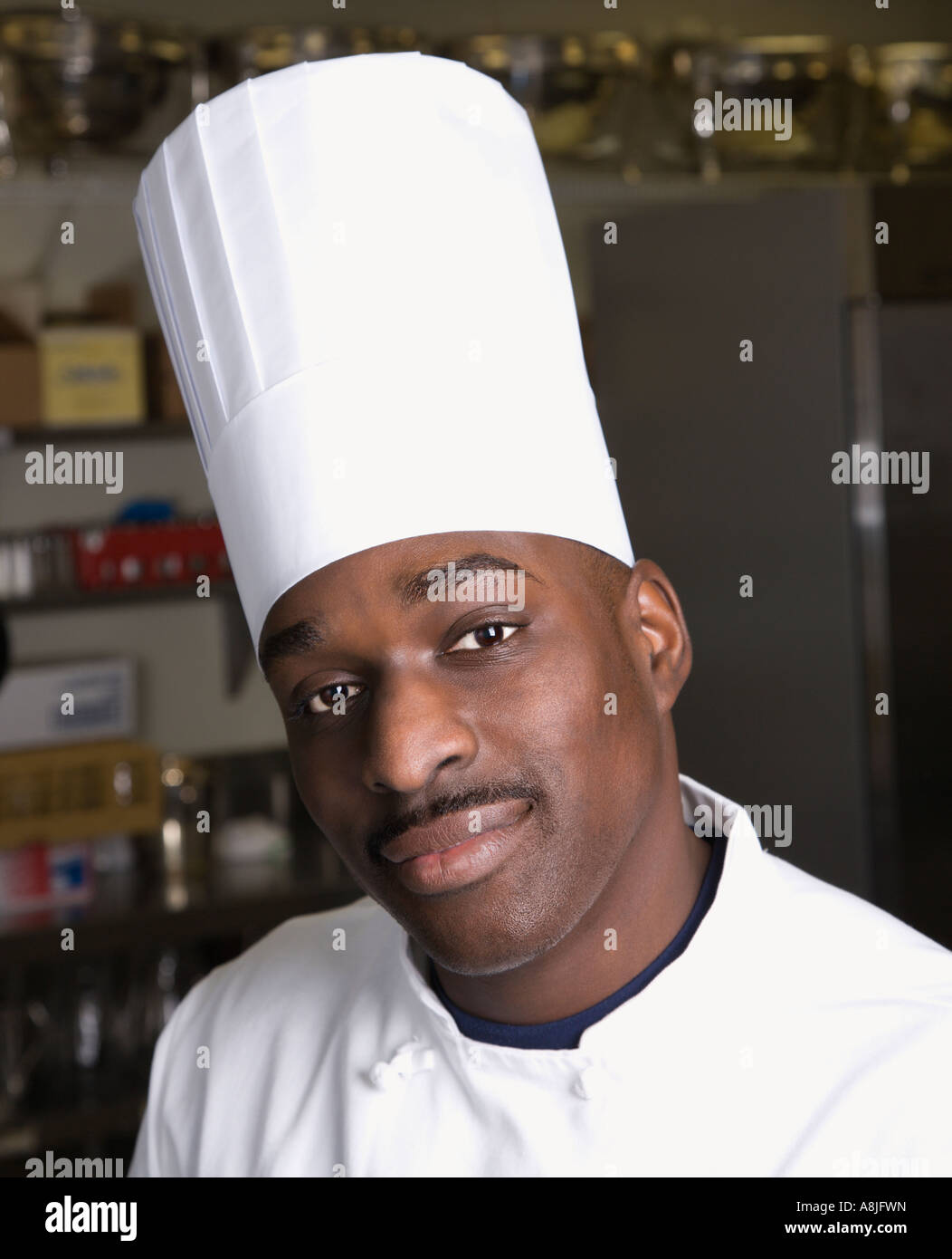 Head shot of African American male chef wearing traditional uniform and ...