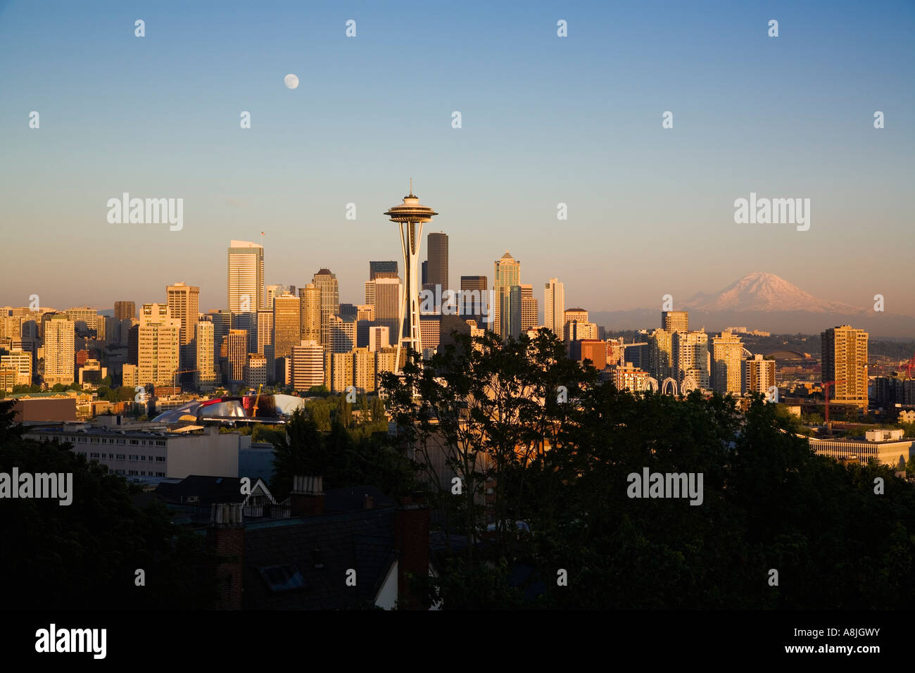 Seattle skyline and Mt Rainier with moon at sunset from Kerry Park ...