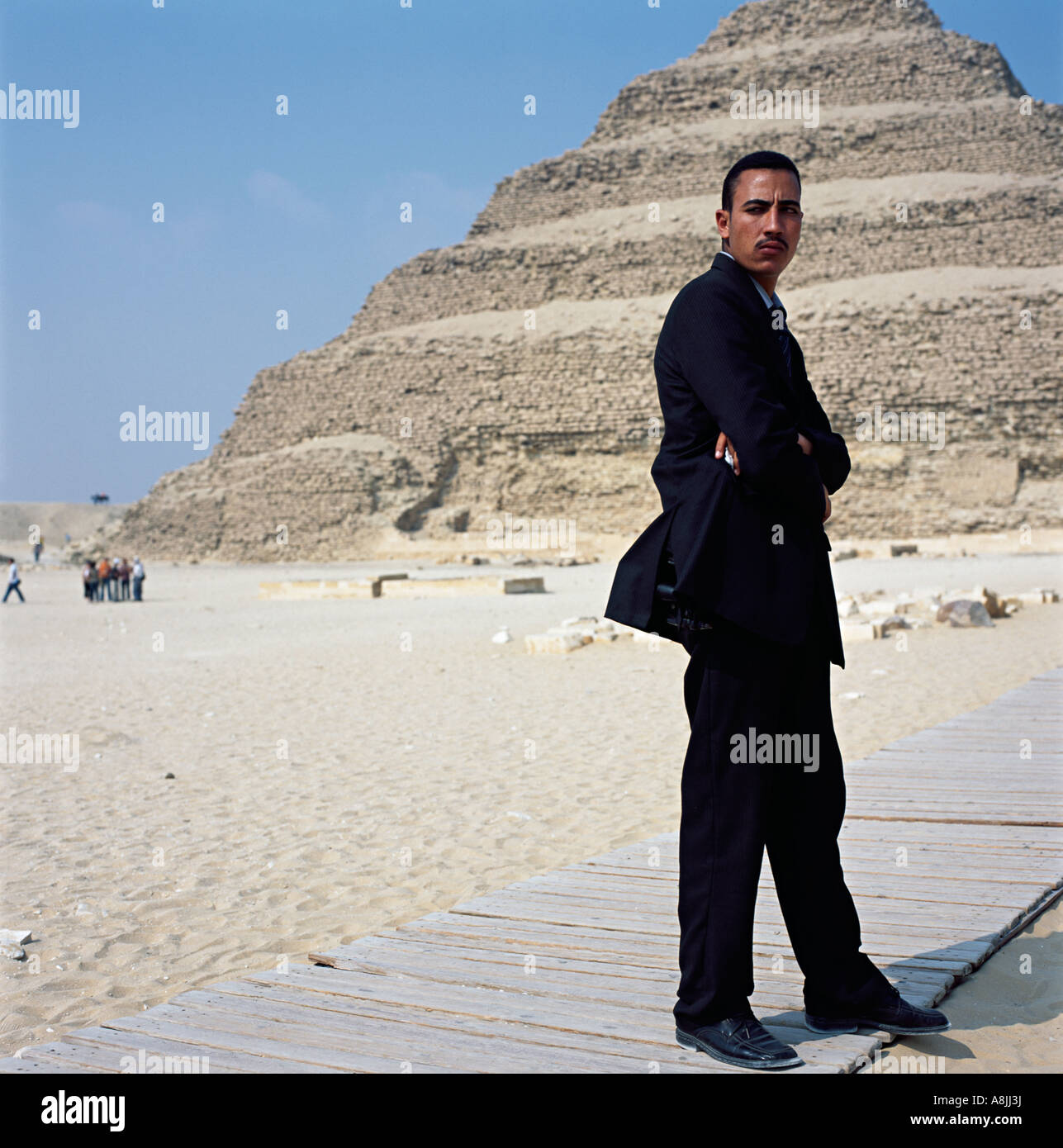 Security guard with concealed semi automatic pistol infront of the Step ...