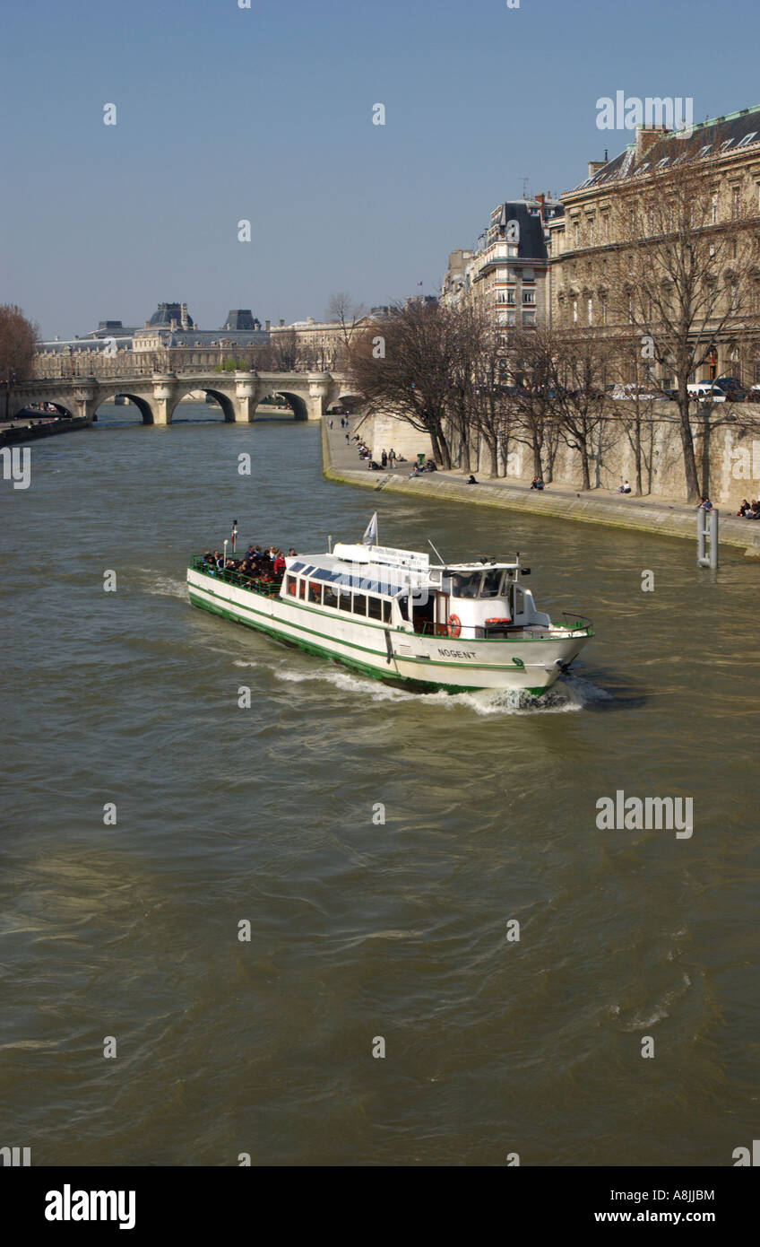 River Boat (Bateaux-Mouches) cruises on a sunny spring day on the River ...