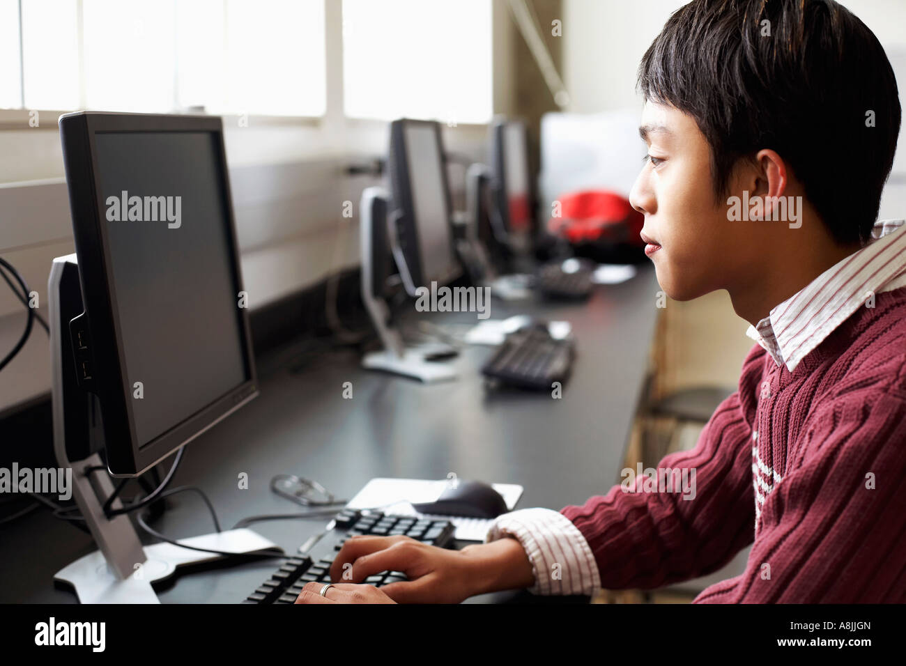 Side profile of a businessman using a computer Stock Photo - Alamy