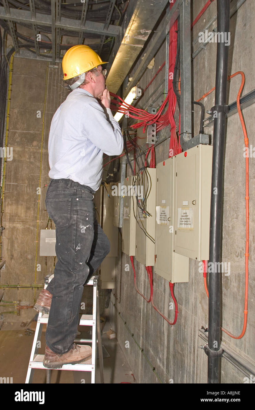 electrical engineer checking industrial wiring panel Stock Photo - Alamy