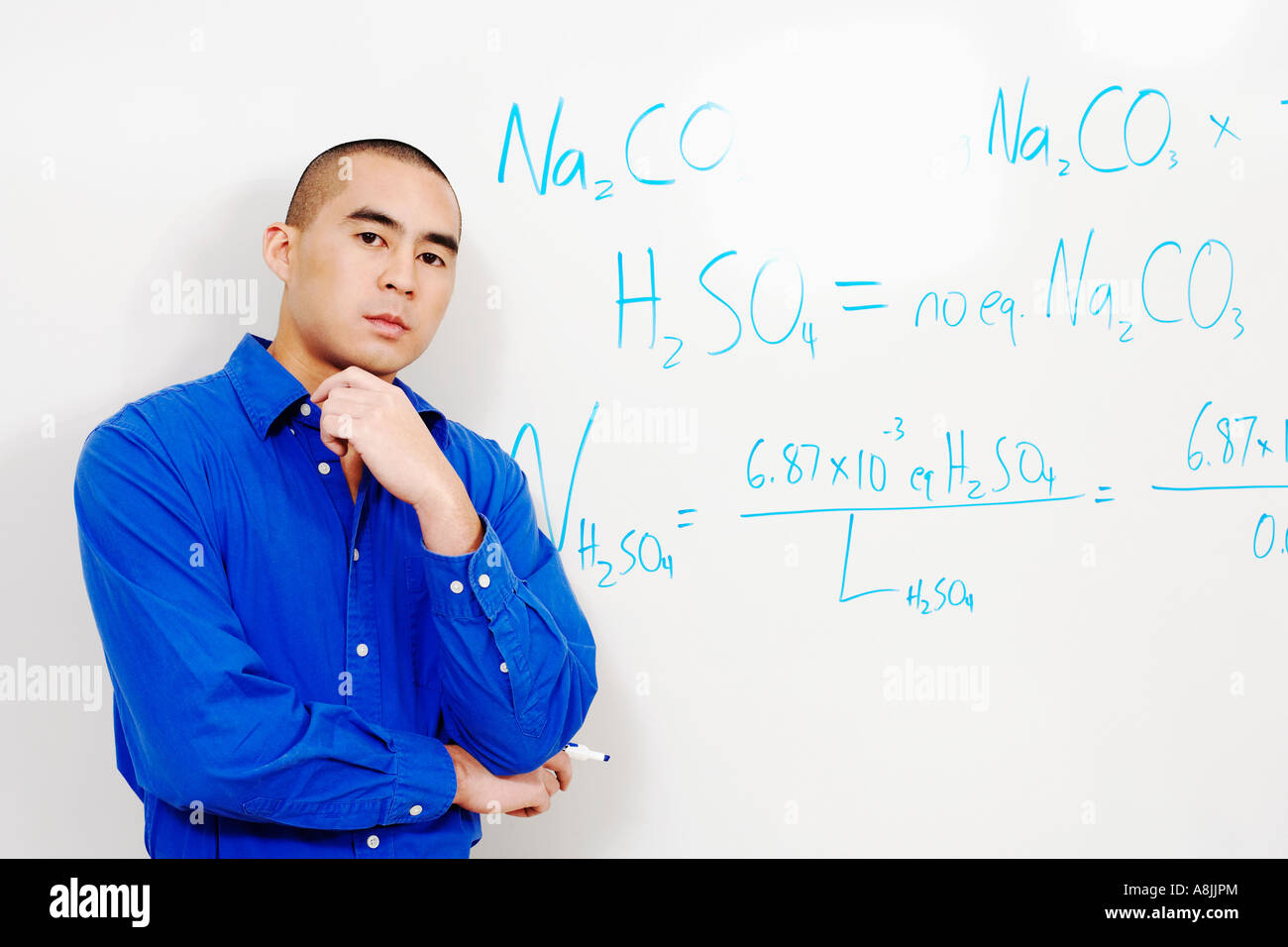 Portrait of a professor standing against a whiteboard Stock Photo - Alamy