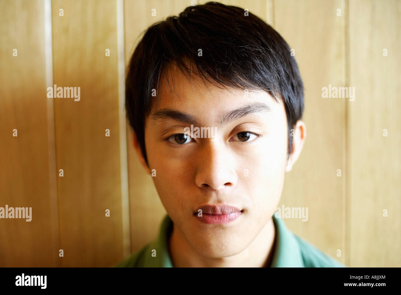 Portrait of a young man looking serious Stock Photo - Alamy