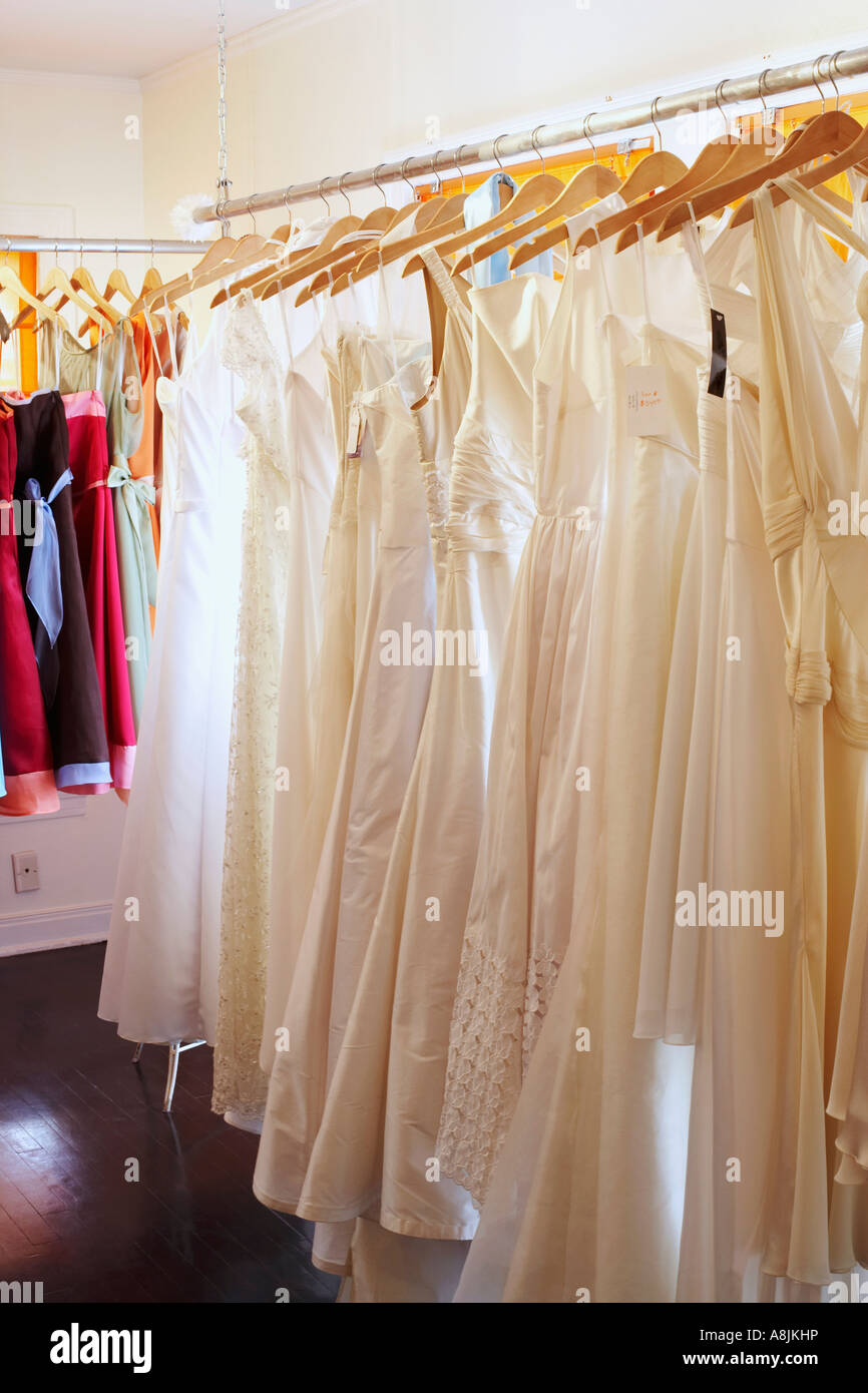 Wedding dresses hanging on a rack Stock Photo - Alamy