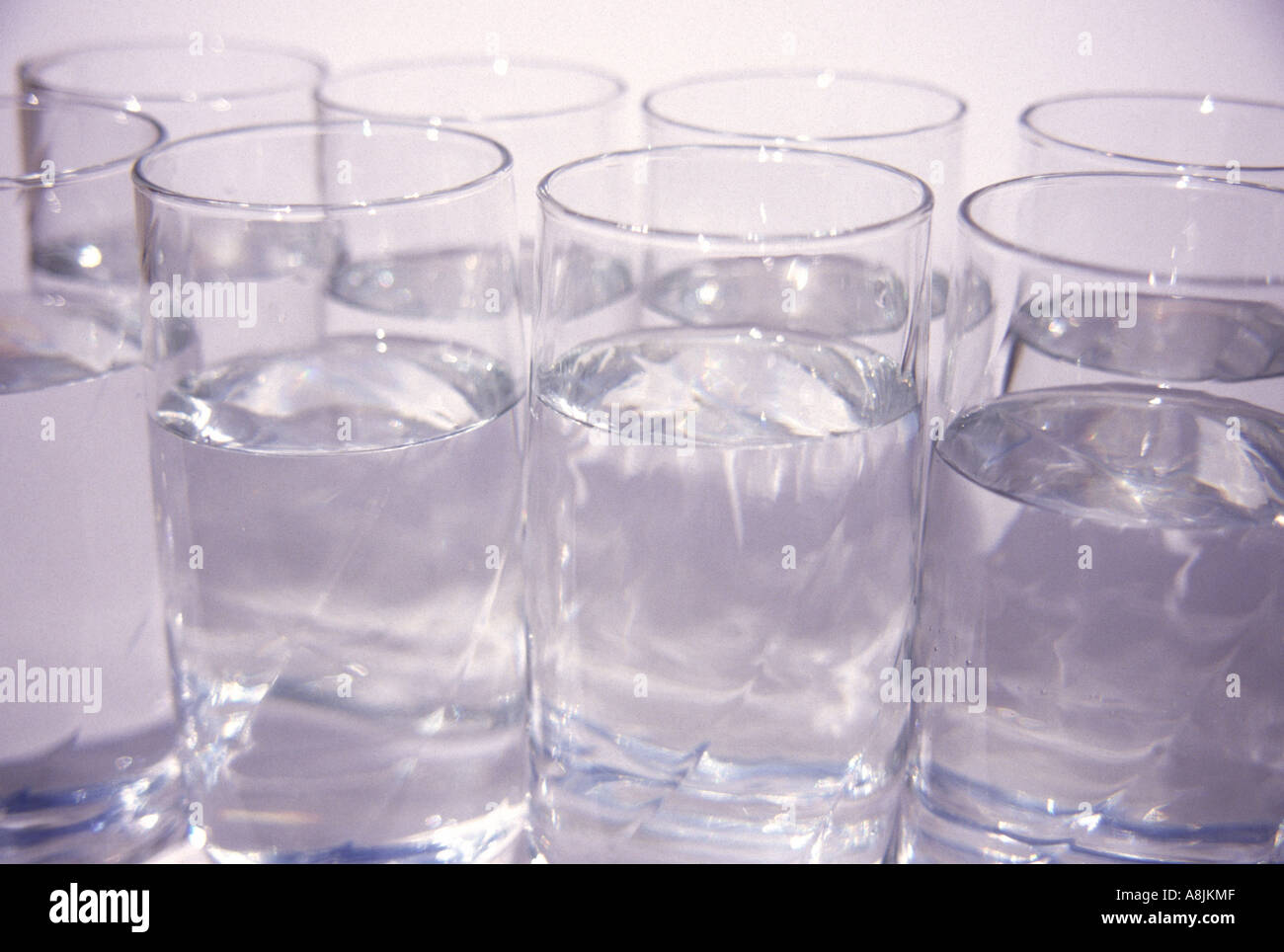 8 glasses filled with water Stock Photo - Alamy