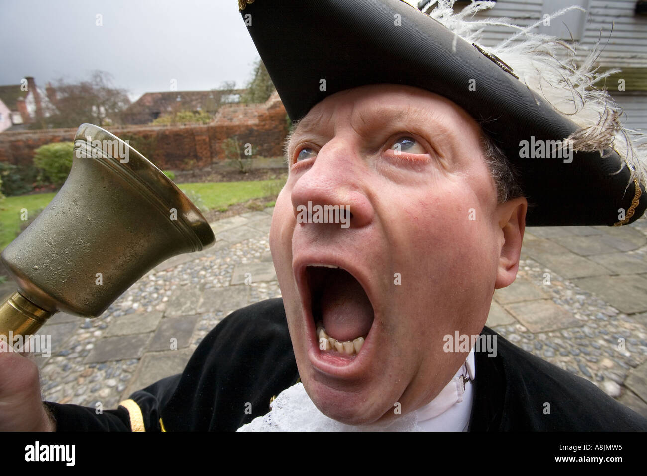 Colchester Town Crier Robert Needham in action ringing his bell and ...