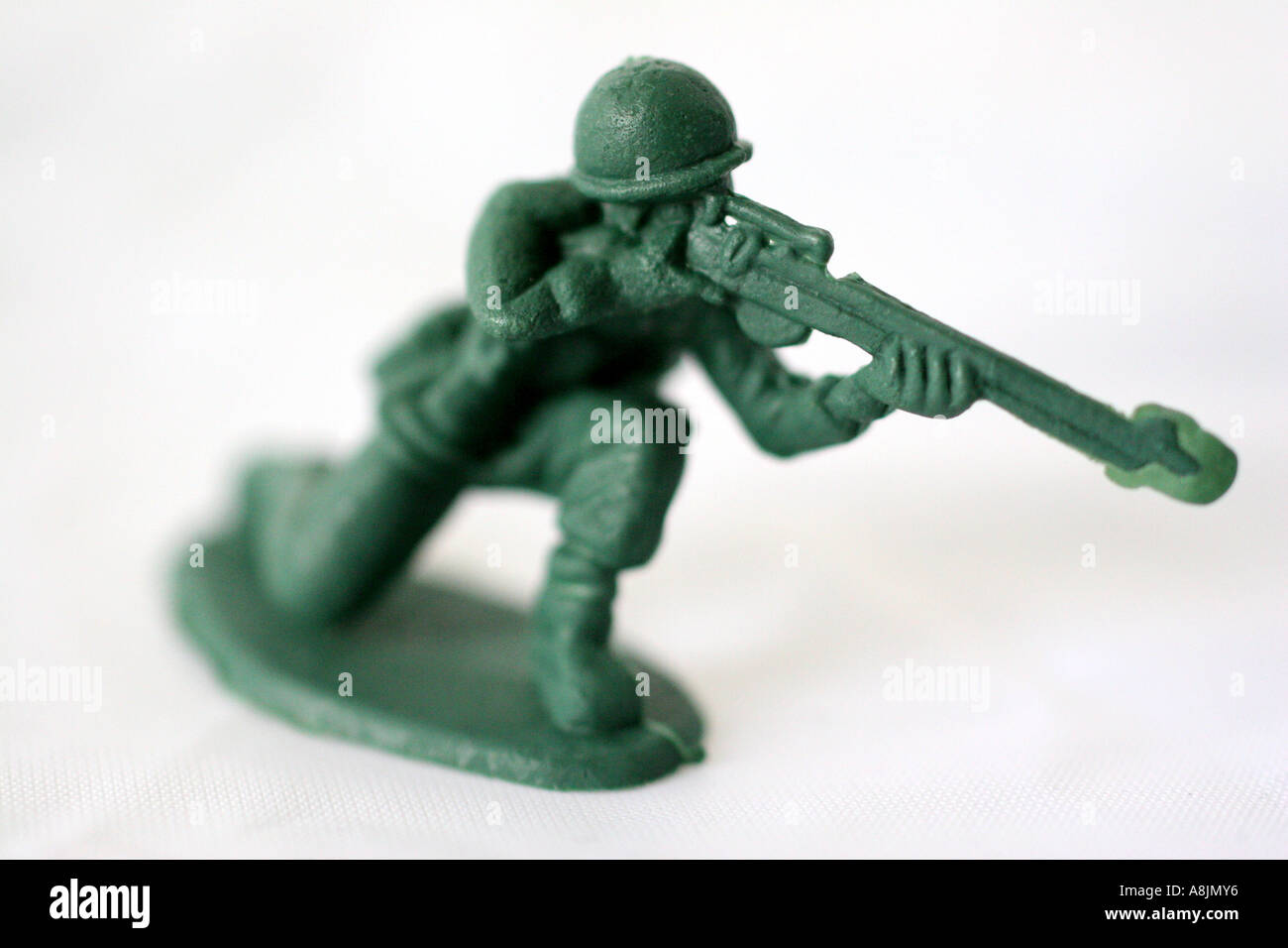 kneeling toy plastic soldier holding rifle Stock Photo - Alamy