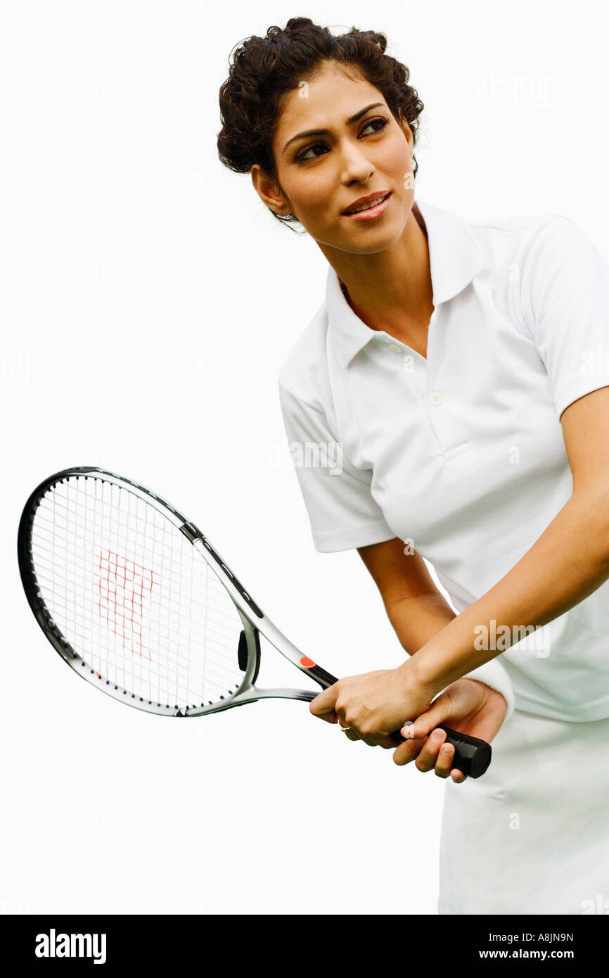 Young woman holding a tennis racket Stock Photo - Alamy