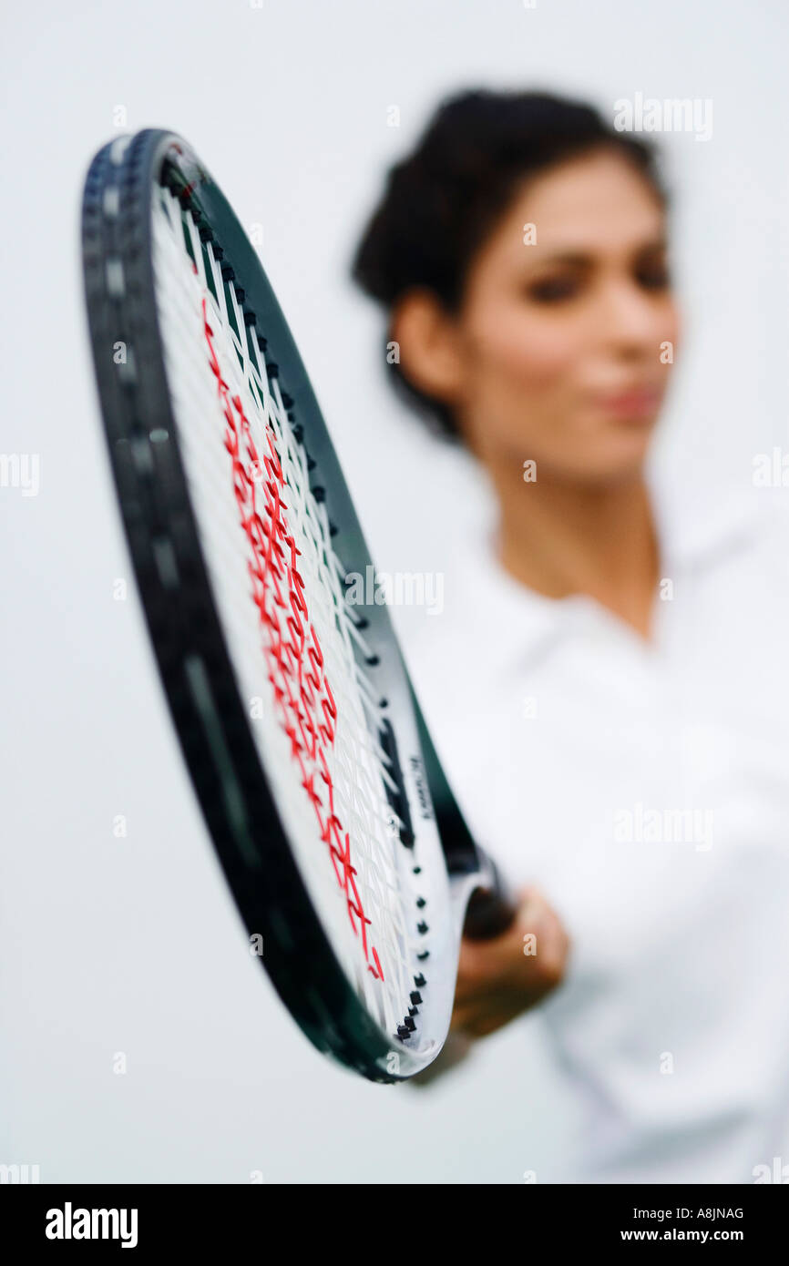 Young woman holding a tennis racket Stock Photo - Alamy