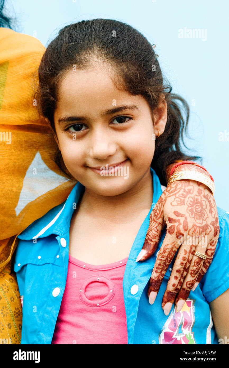 Portrait of a girl with her mother grinning Stock Photo - Alamy