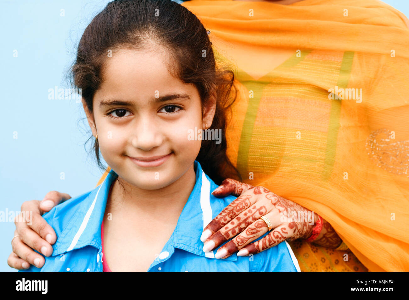Portrait of a girl with her mother grinning Stock Photo - Alamy